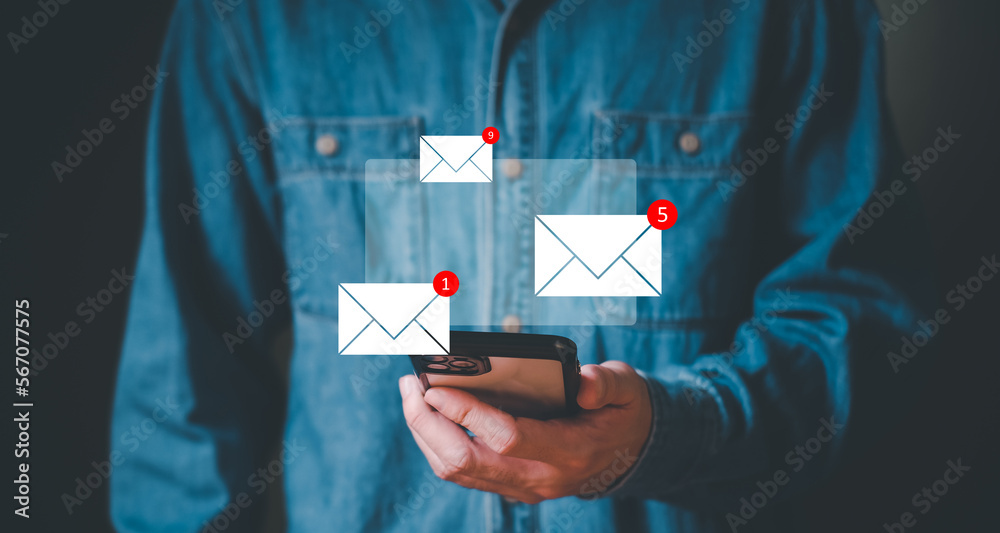 Businessman working in front of laptop computer while check email or ...