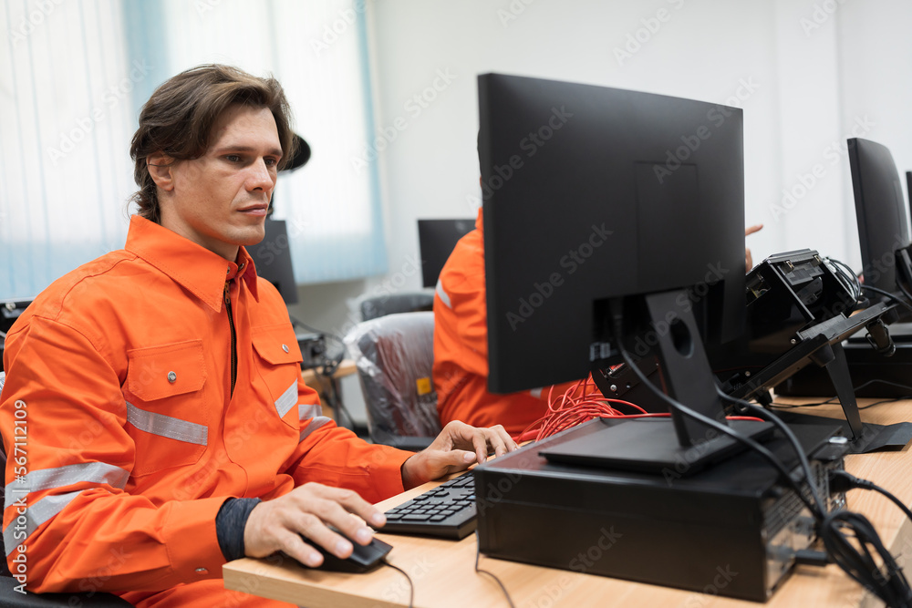 Team male engineers using desktop computer training Programmable logic ...