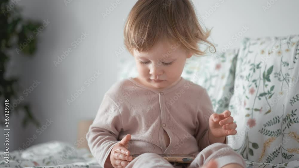 Cute sweet boy tap on phone screen of mobile smartphone. Little toddler ...