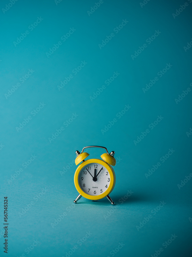 clock on blue background Stock Photo | Adobe Stock
