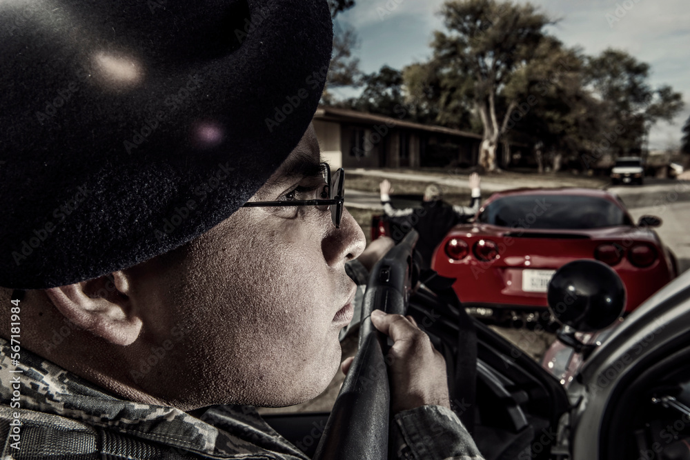 An Air Force Security Forces member orders the driver to exit his ...