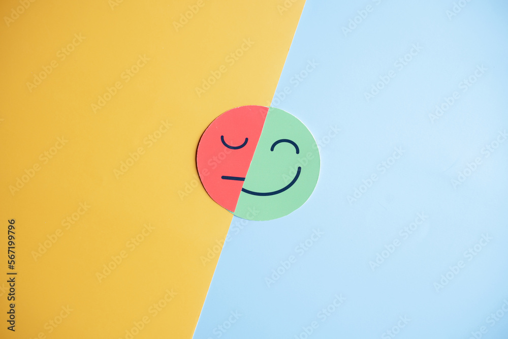 ภาพประกอบสต็อก Happy smiley face hiding or behind sad face, change ...