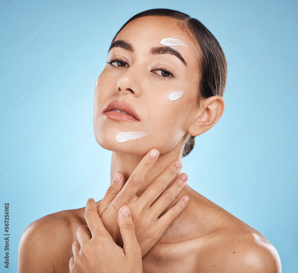 Face portrait, skincare cream and woman in studio isolated on a blue ...