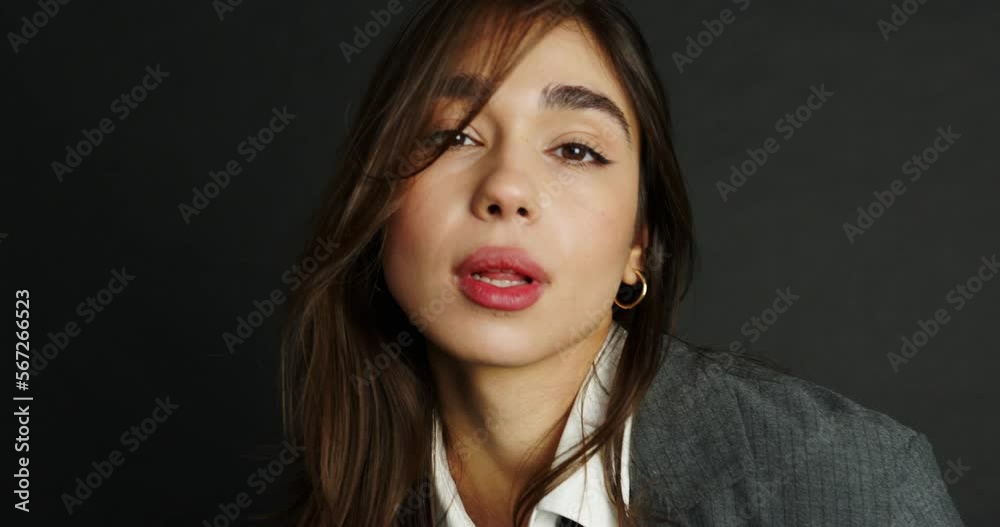 business woman model in a classic suit and tie poses for the camera ...