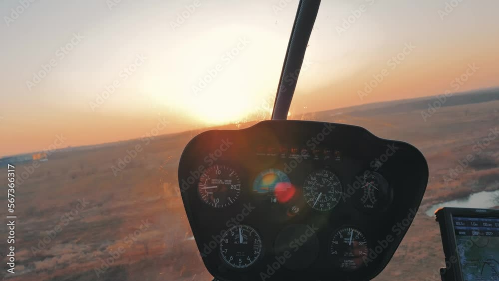 View from the inside of a helicopter through windshield while flying on ...