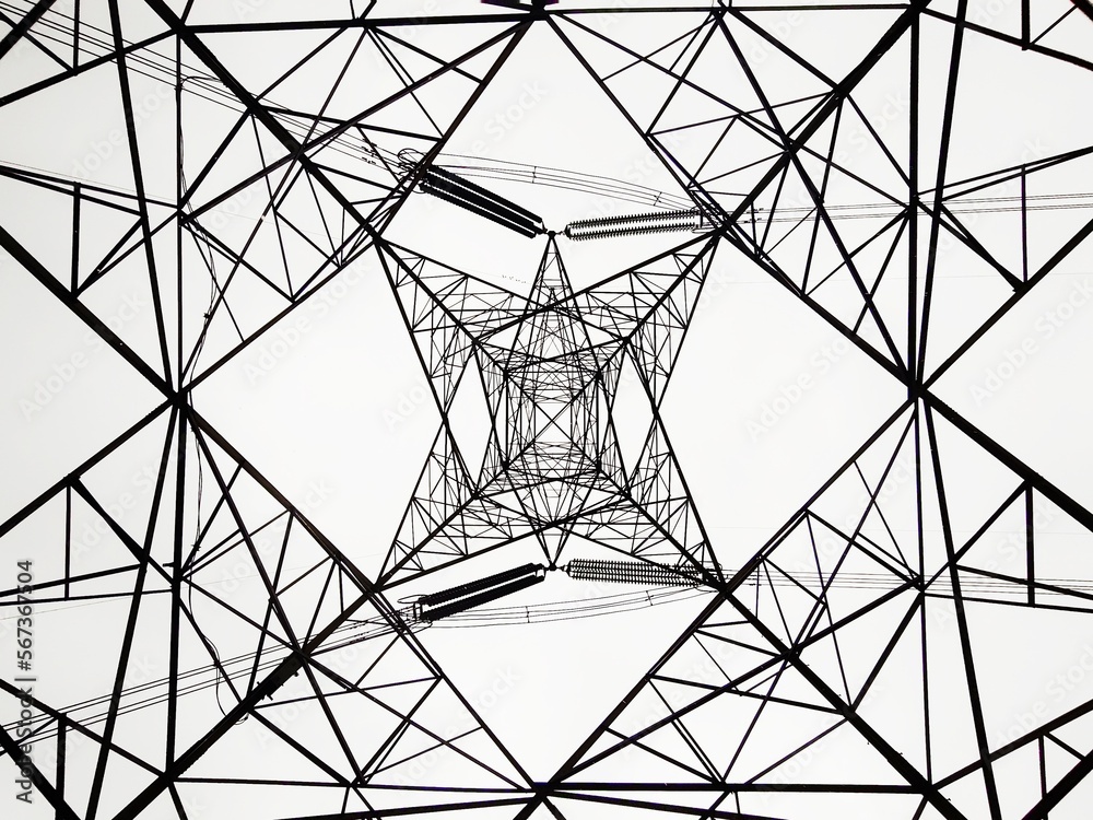 Minimalist electric transmission tower captured from below offers a ...
