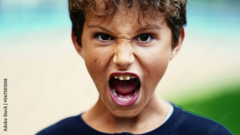 Angry small preteen boy looking at camera being furious. upset child ...