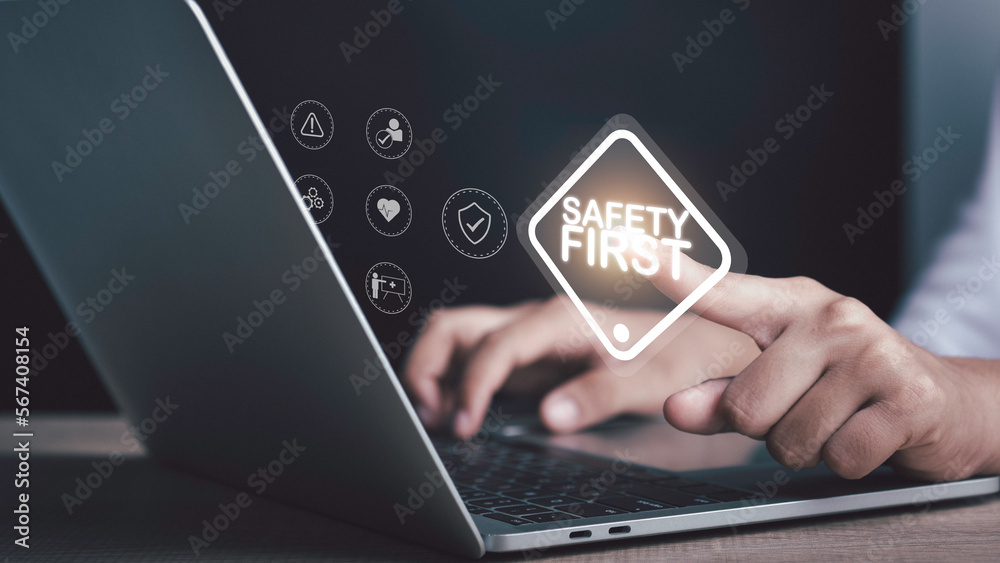 Work safety concept. Businessman touching Safety first text . Safety ...