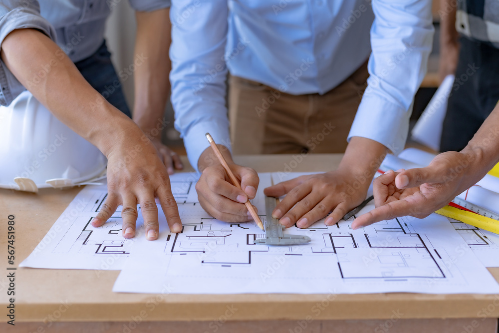 Engineer or architect plan meeting and draw model of office buildings ...