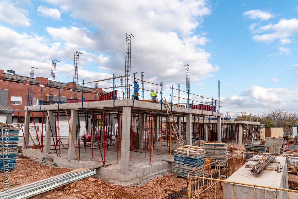 Construction site with steel formworks and reinforcing bars for pillars ...