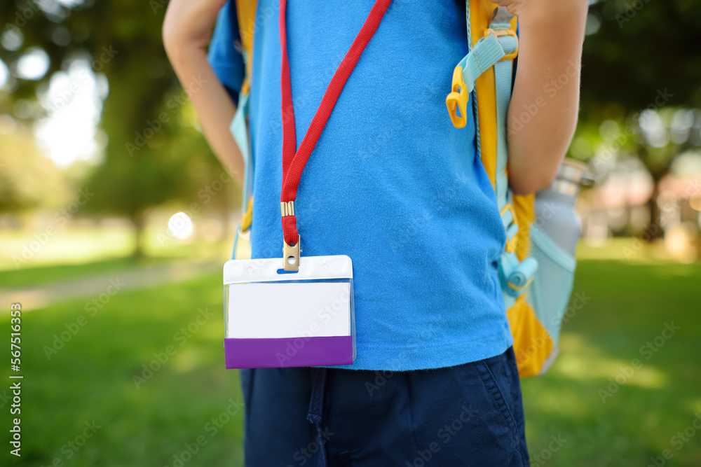 Child with name badge on neck goes to school. Icon has white blank card ...