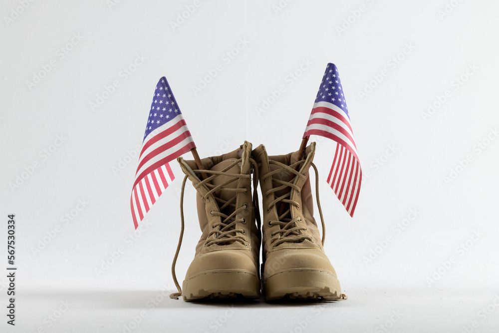 Military boots with flags of usa on white background, with copy space ...