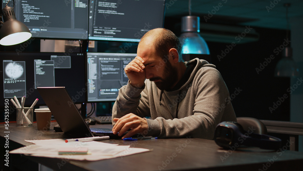 Obraz Male coder feeling sleepy and working on programming code, typing ... Obraz Male coder feeling sleepy and working on programming code, typing ...