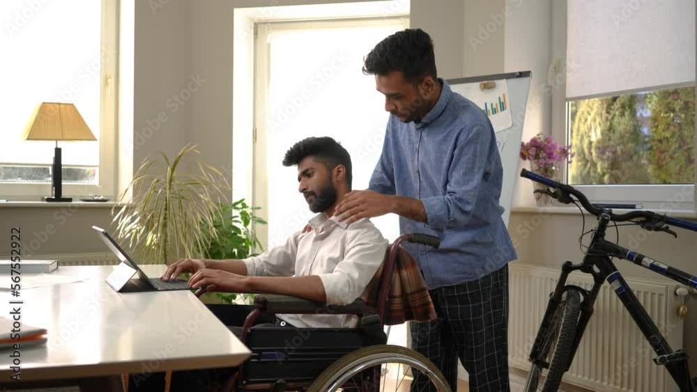 Side view young Middle Eastern man tapping shoulder of friend in ...