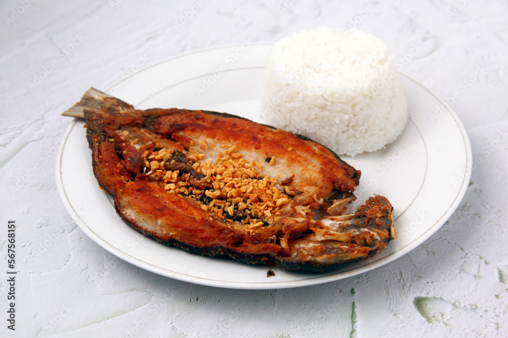 Freshly cooked Filipino food called fried bangus or milkfish and fried ...