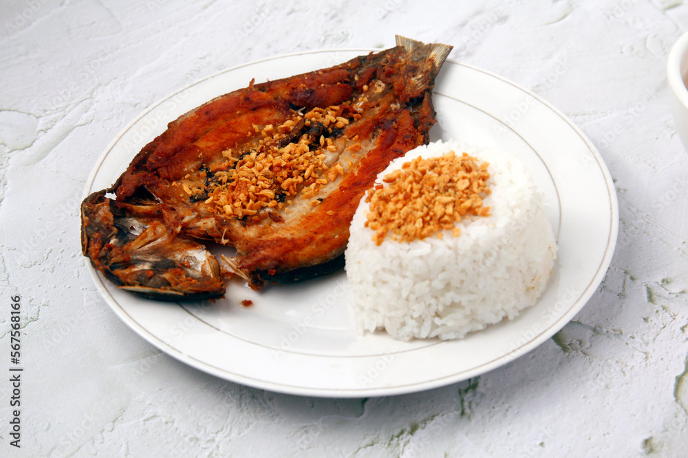 Freshly cooked Filipino food called fried bangus or milkfish and fried ...