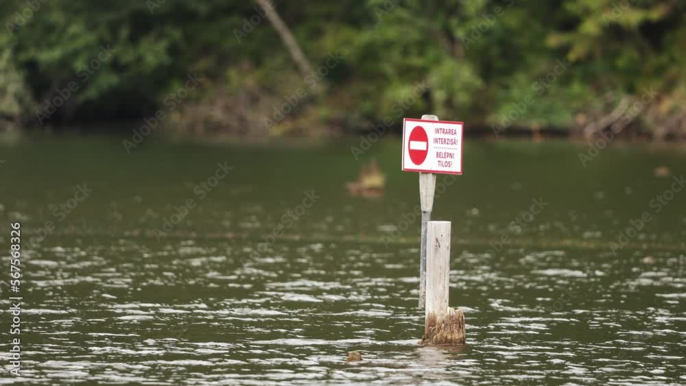 No Entry Sign On The Wooden Pole At Red Lake In Romania. - static Stock ...