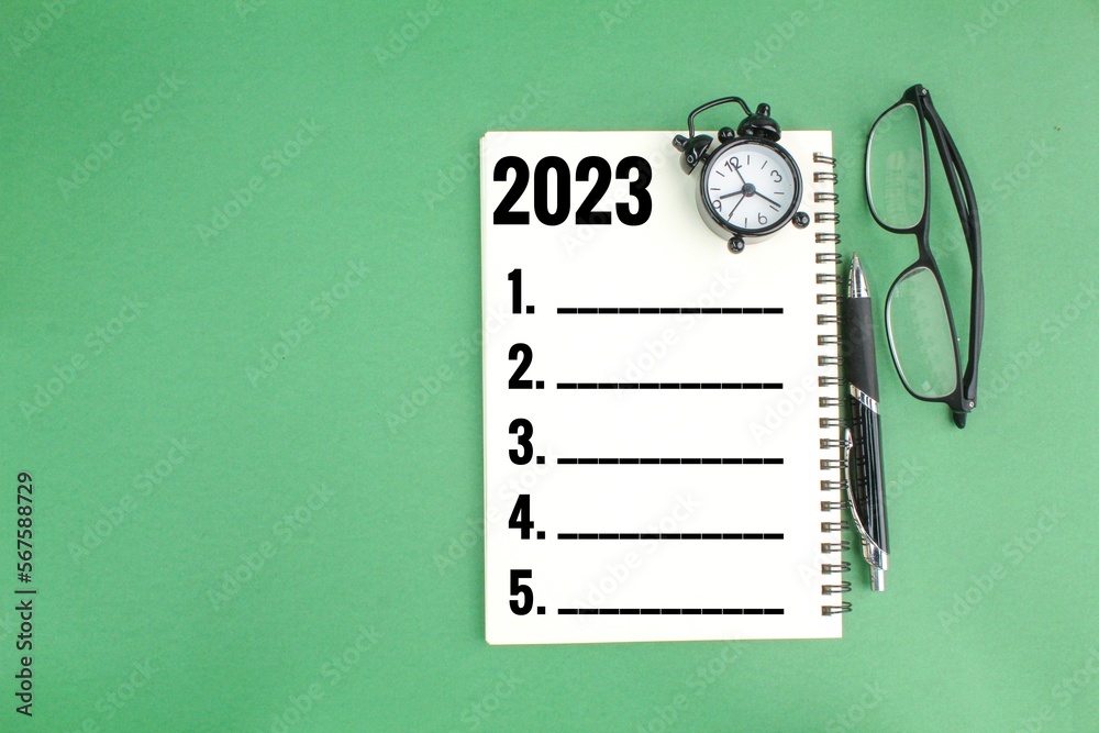 notebook with a list or goals for the year 2023. 2023 goals ...