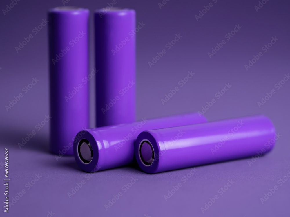 Battery. Cylindrical battery, type 18650 on a purple background ...