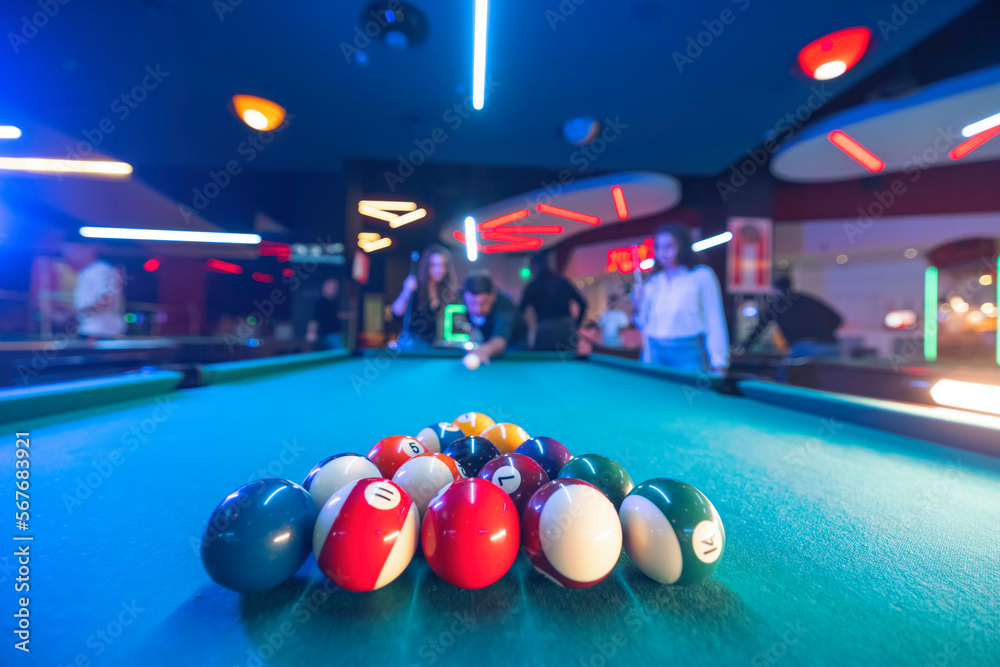 friendly game of billiards brings together players of all backgrounds ...