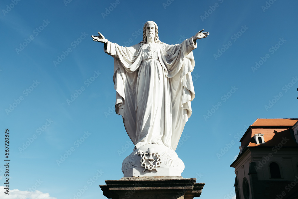 Jesus Christ with open arms statue in front of Pilgrimage Basilica of ...