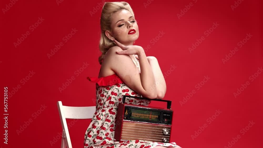 Romantic song. Beautiful woman with stylish hairstyle posing with retro ...