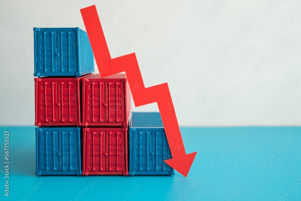 Red economy graph chart falling down collapse with containers on wooden ...