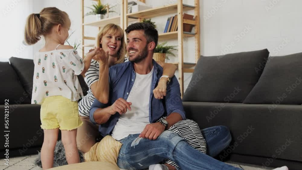 Little girl playing guessing game with parents Stock-Video | Adobe Stock