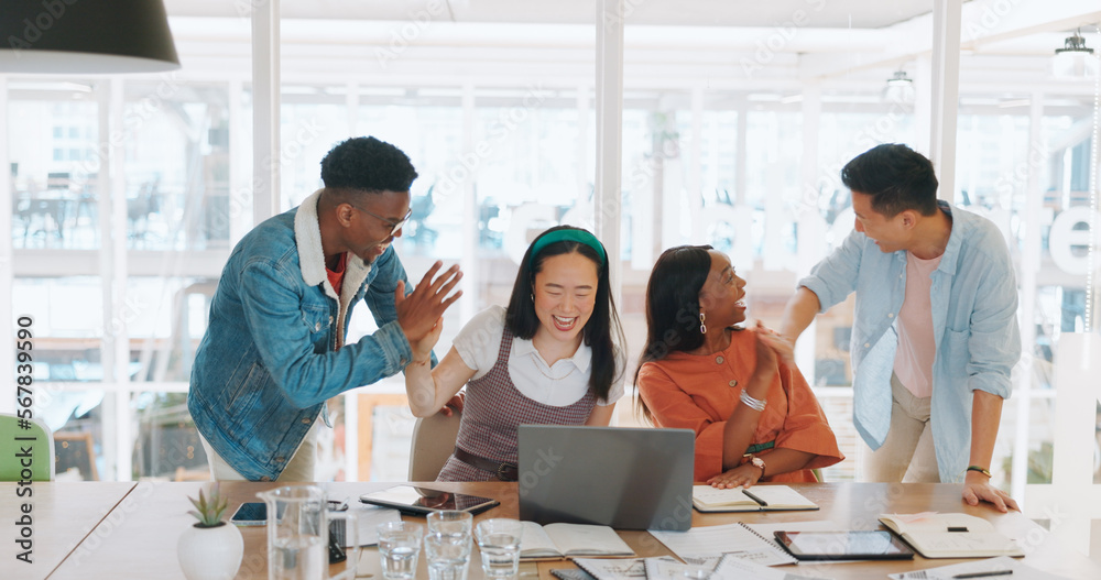 Celebration, laptop and business people high five, applause and celebrate goals, targets or ...