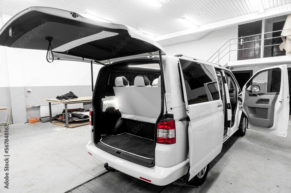 Comfortable interior of a passenger bus with soft seats. The design is ...