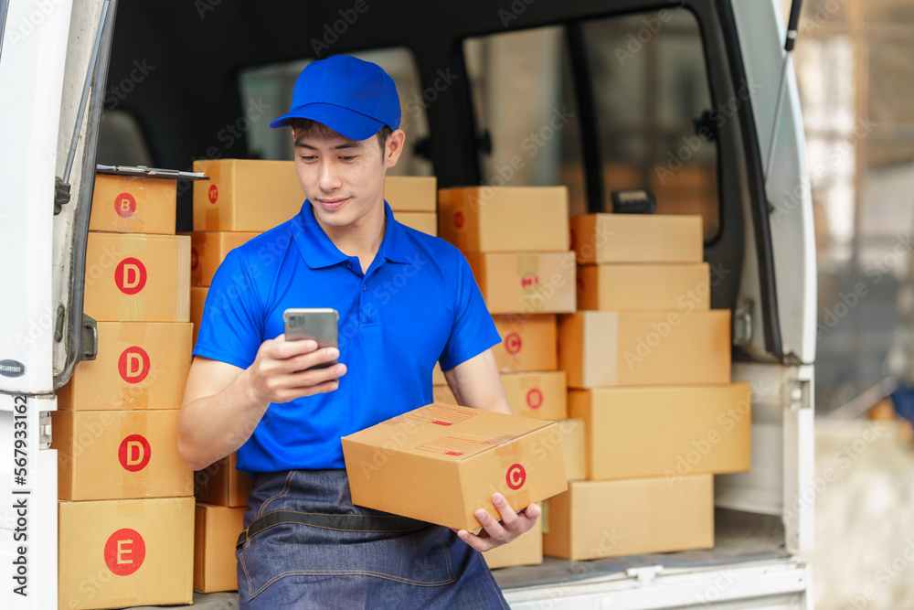 Delivery man asia people checking portable delivery device with parcel ...