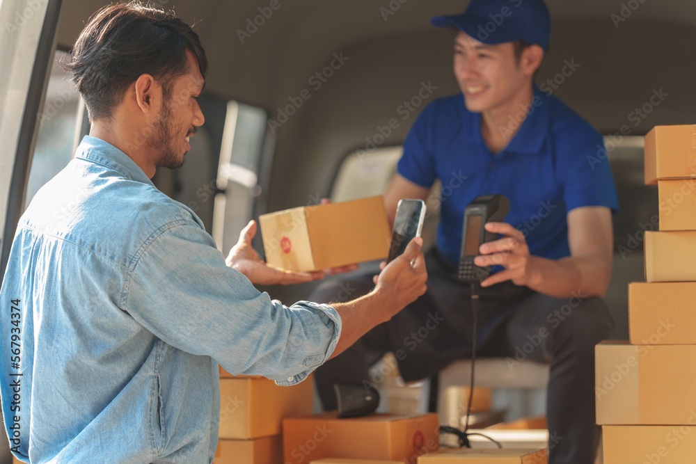 Delivery man asia people checking portable delivery device with parcel ...