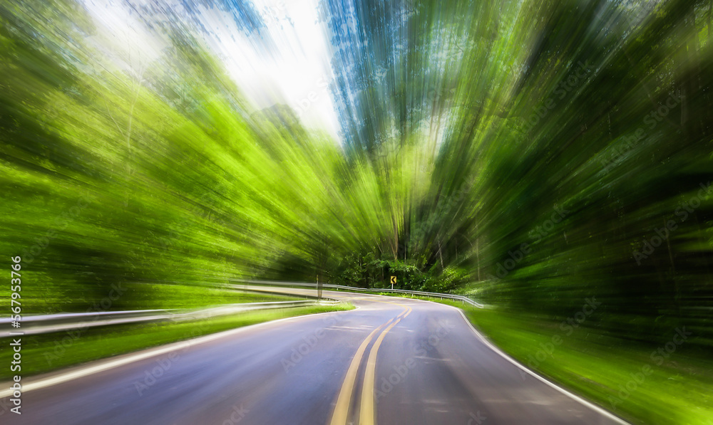 blur background., country road that looks like it moves towards a curve ...