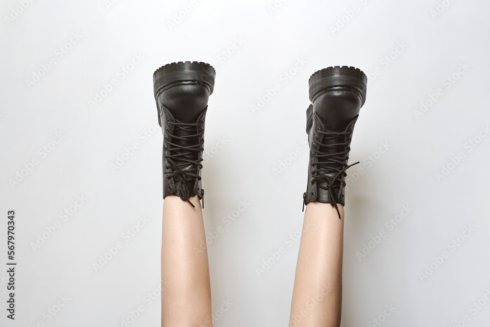 Woman legs in black combat boots on high heel platform with lug soles ...