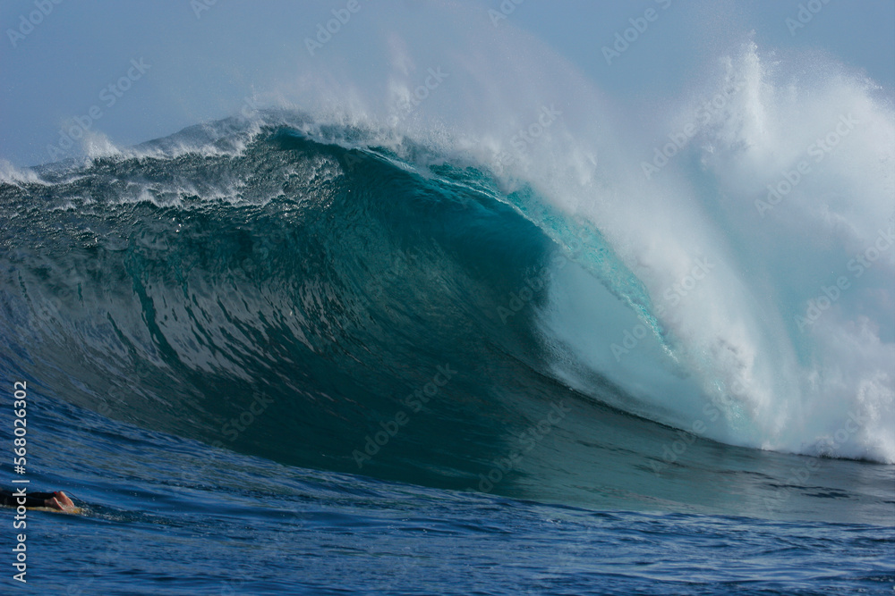 A huge blue ocean wave breaks at the famous South African big wave spot ...