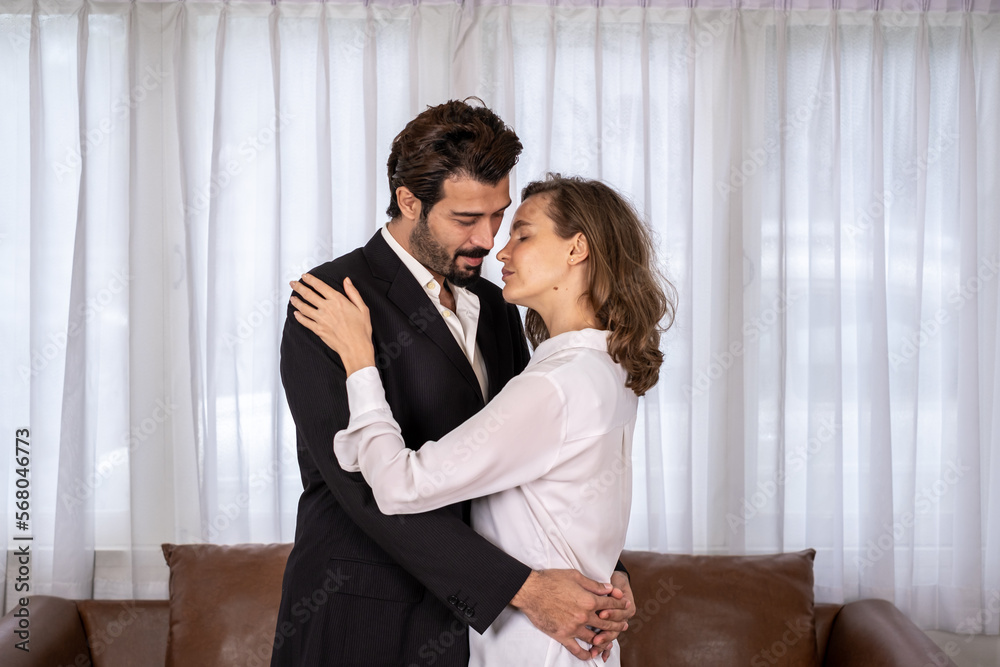 Young couple hugging each other before and after work. Sweet couple hug ...