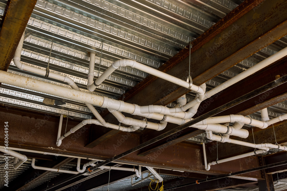 Installation an assembled in waste pipe lines system under ceiling of ...