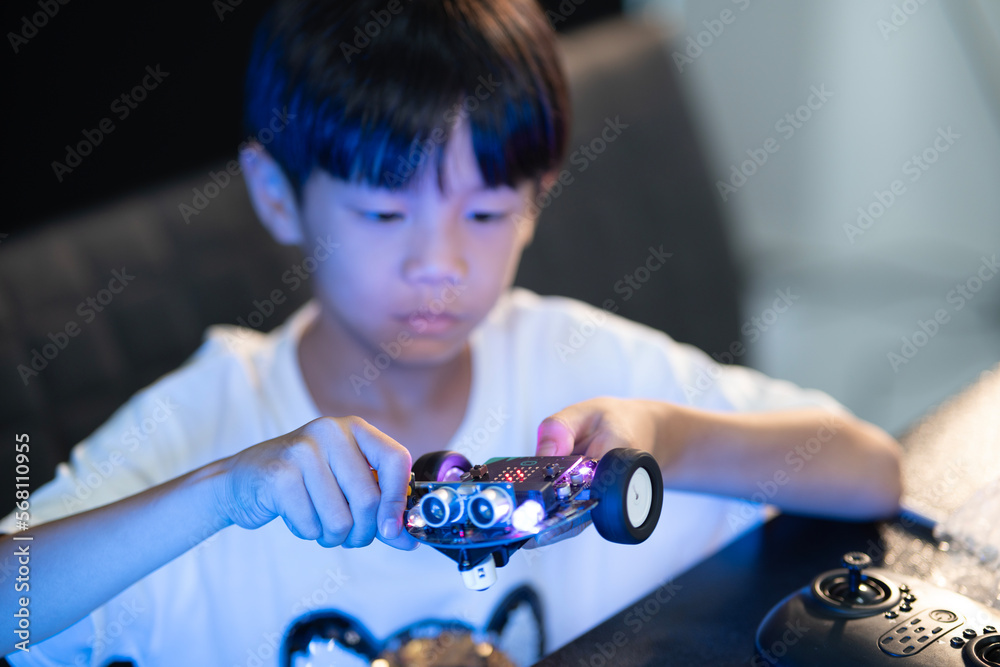 Kid doing science invention experiment on mechanical robots Stock Photo ...