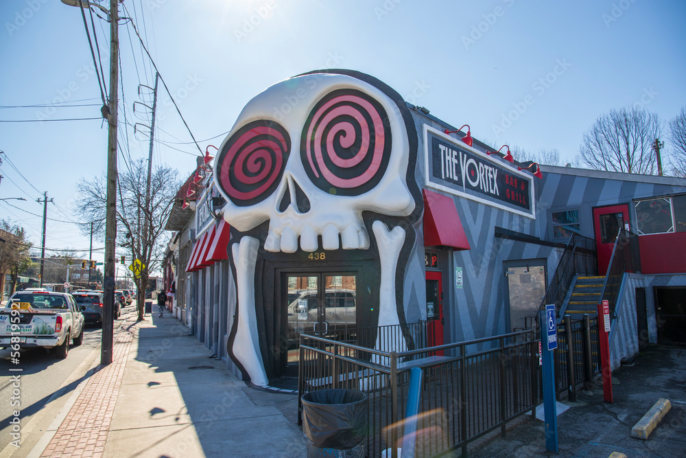 The Vortex Bar and Grill with a skull over the top of the door,, bare ...