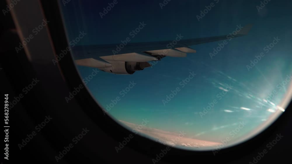 Airplane flight. Wing of an airplane flying above the clouds. Looking ...