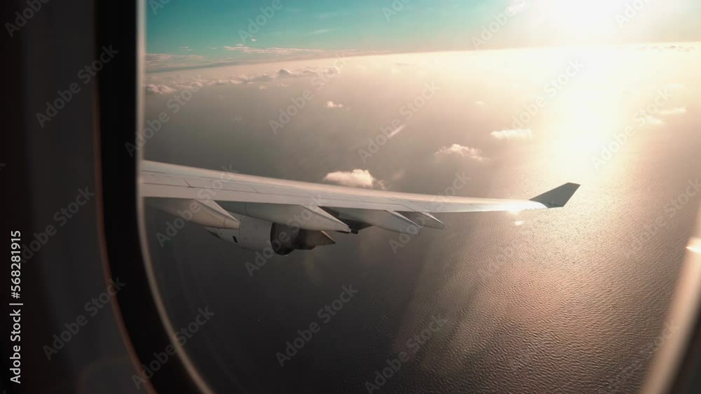 Airplane flight. Wing of an airplane flying above the clouds. Looking ...
