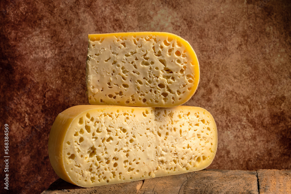 Emmental cheese triangle, Swiss cheese. piece of cheese maasdam with ...