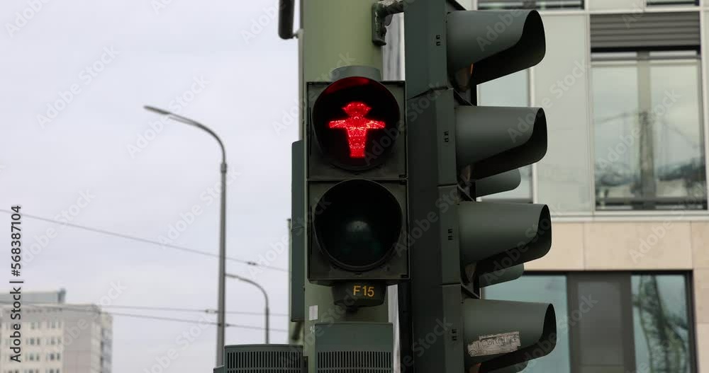 Green and red light to pedestrians on crosswalk in city centre. Famous ...