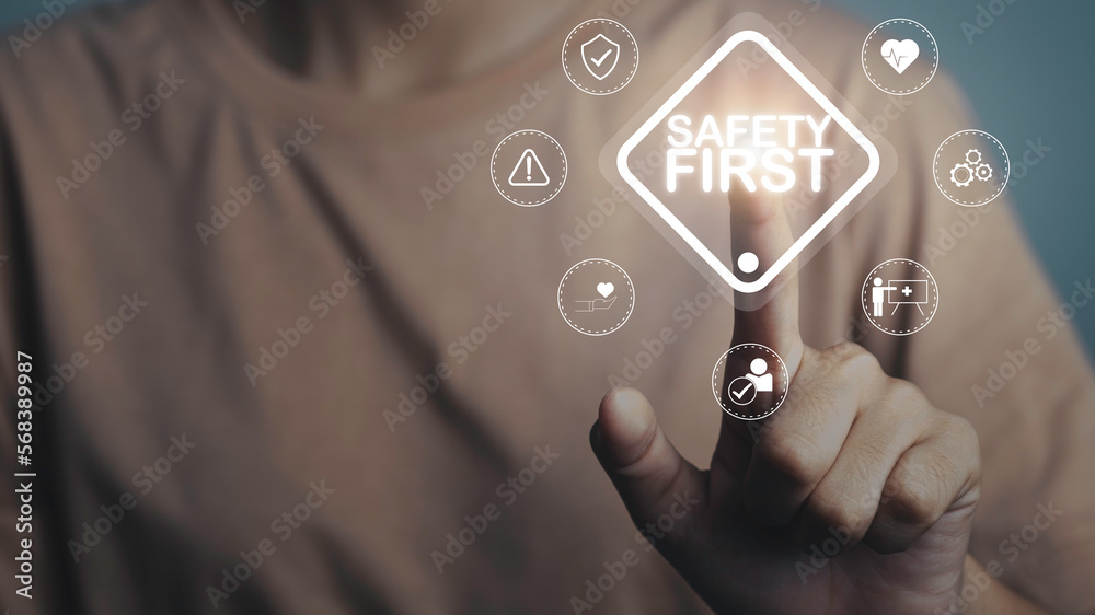 Work safety concept. Businessman touching Safety first text . Safety ...