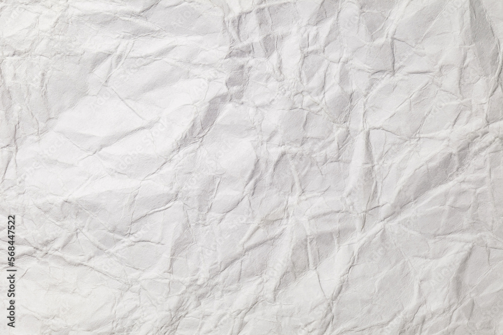 Crumpled white paper with bends and fractures, uneven surface ...