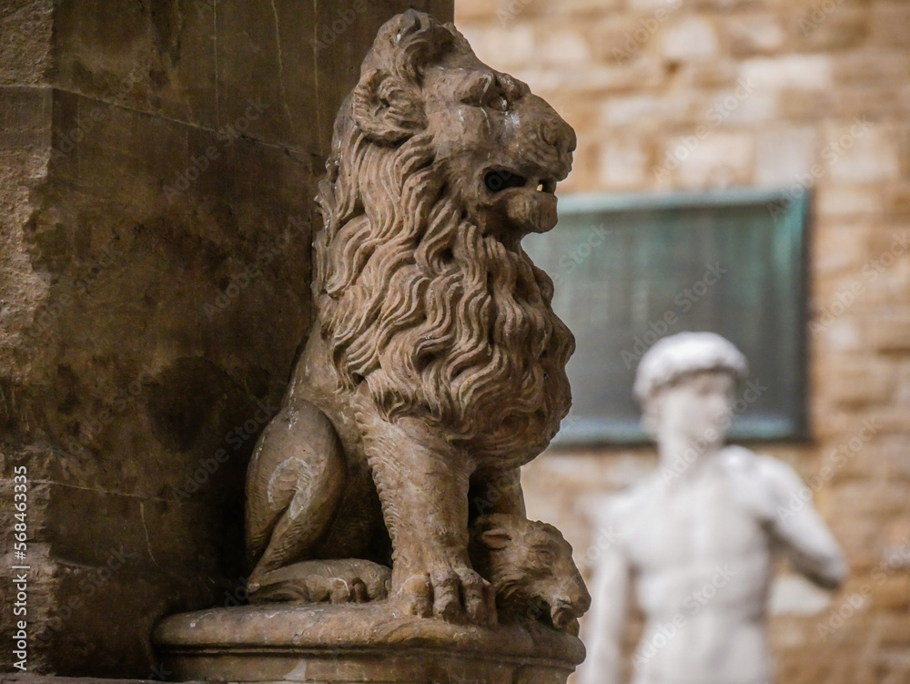 lion statue which represents the symbol of Florence, in the background ...