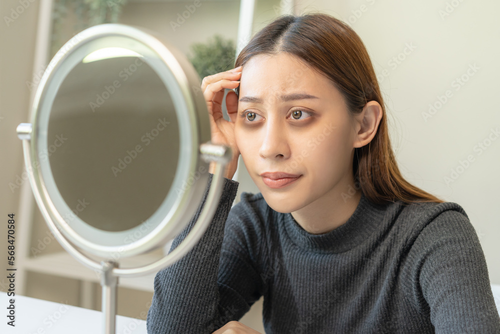 Foto de Bored, insomnia asian young woman, girl looking at mirror hand ...