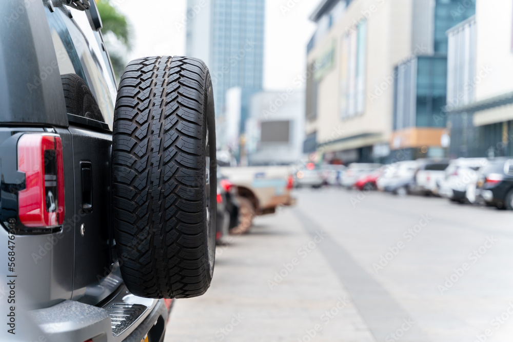 Spare tire. Spare wheel on an off-road vegicle. Spare tire on a car ...
