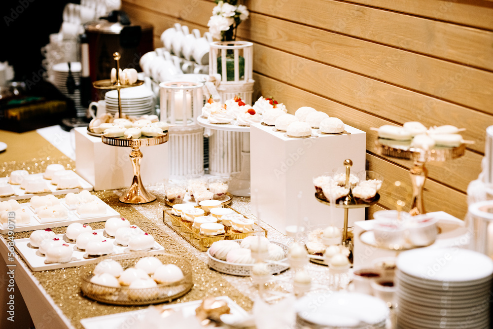 Dessert table full of sweets candy bar on wedding sweet table fruits ...