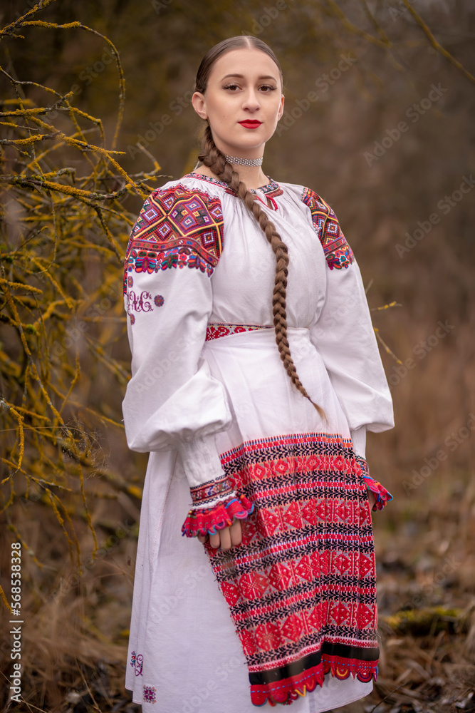 Young beautiful slovak woman in traditional costume. Slovak folklore ...